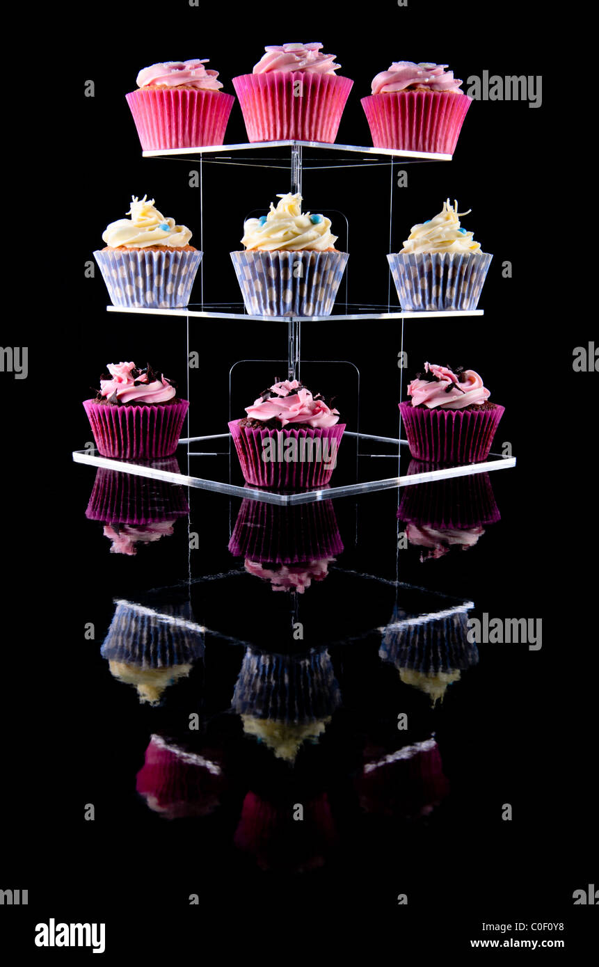Cup Cakes Illuminated on a Tiered Glass Stand Stock Photo - Alamy