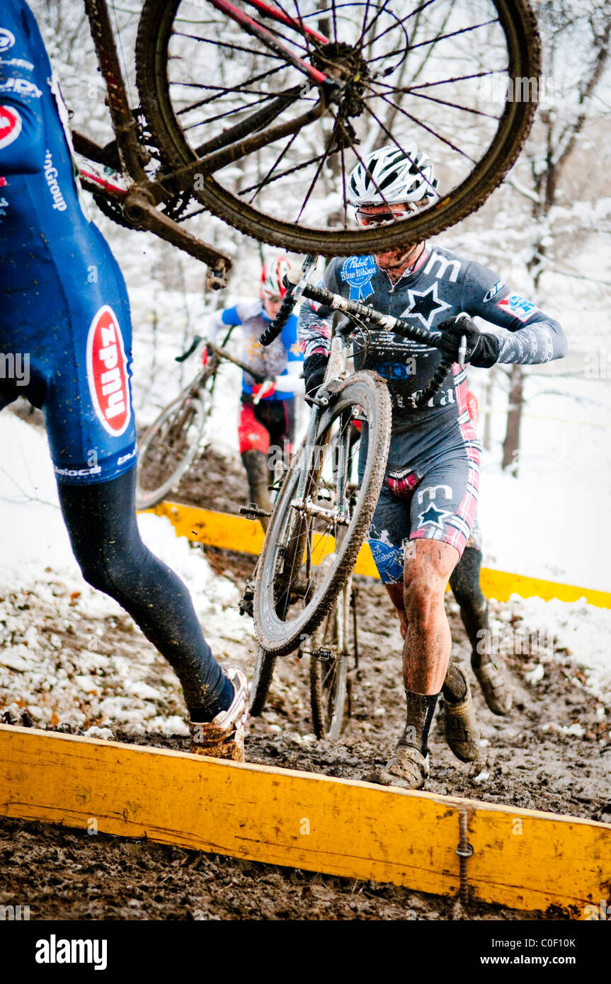 Cyclists race in the mud and snow at a Cyclocross race in Boulder, CO ...