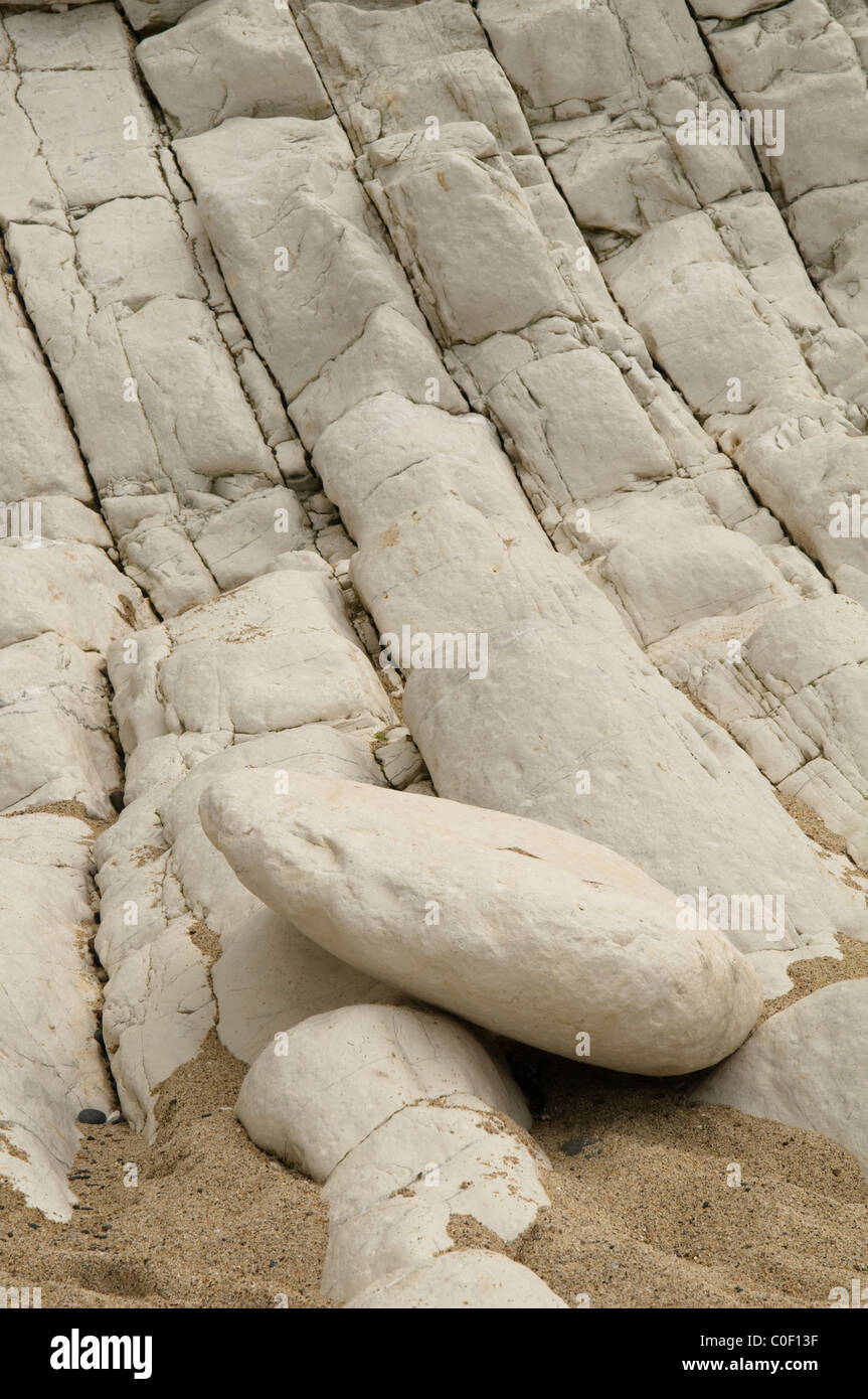 Vertical strata in cliffs on the beach directly below the lighthouse at ...