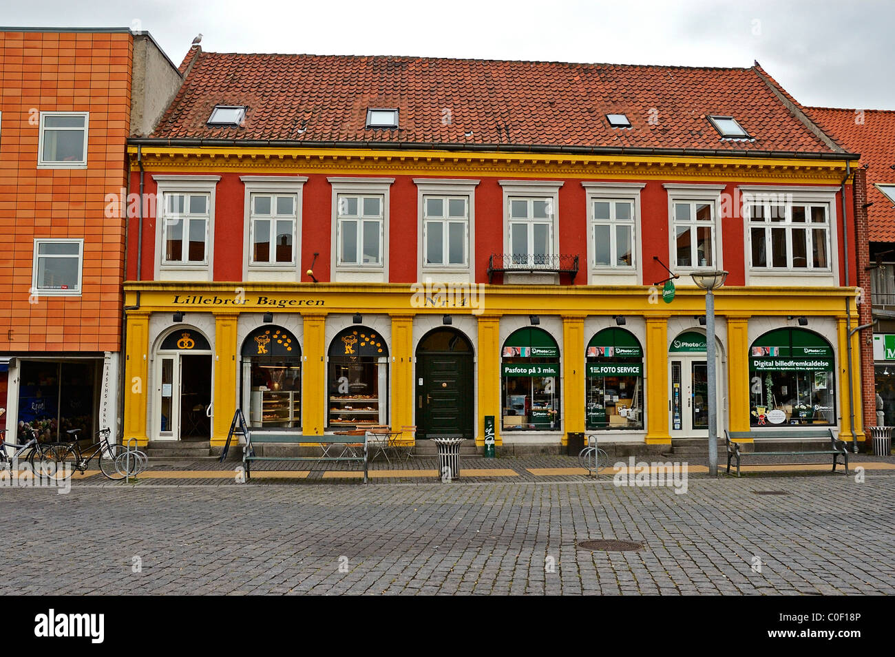 Traditional living accommodation above a row of shops with arched ...
