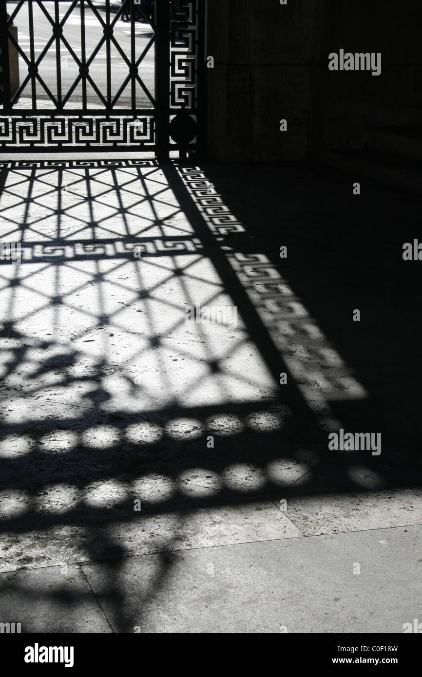 old gate shadow on street road Stock Photo - Alamy