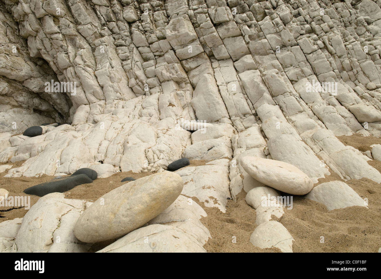 Vertical strata in cliffs on the beach directly below the lighthouse at ...