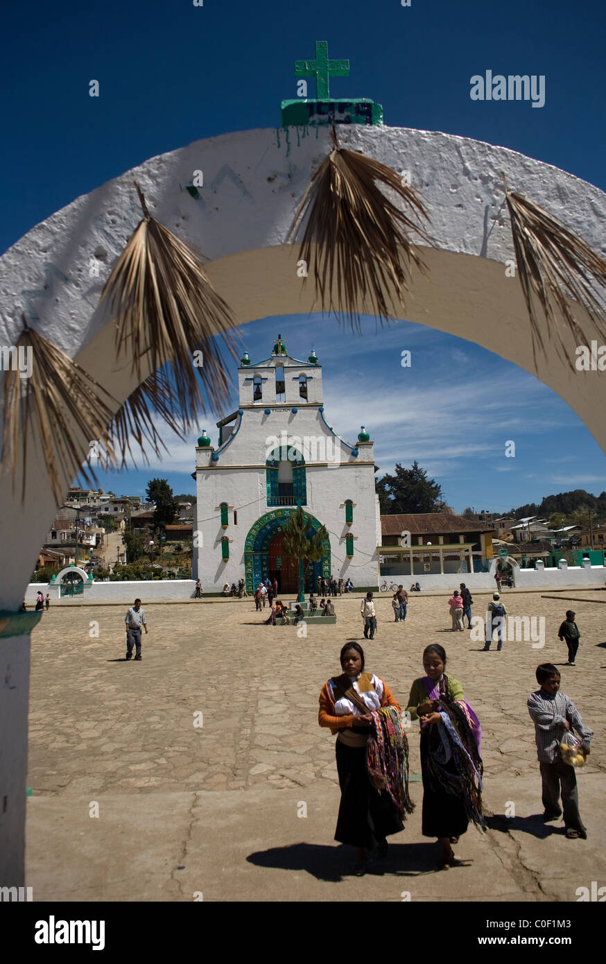 Street vendors sell souvenirs in the main plaza outside the church of ...