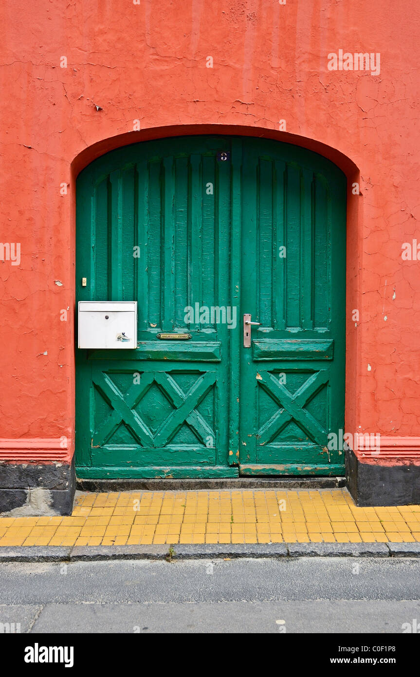 Steps leading to a large green double door in a traditional style house ...