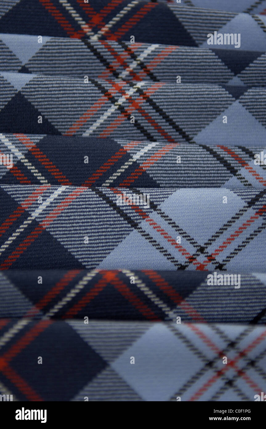 Lochcarron of Scotland factory in Selkirk, rolls of tartan on shelf ...
