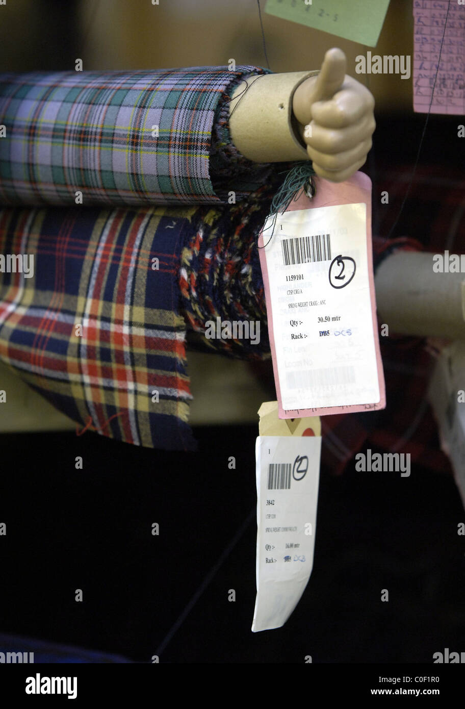 Lochcarron of Scotland factory in Selkirk, rolls of tartan on shelf ...
