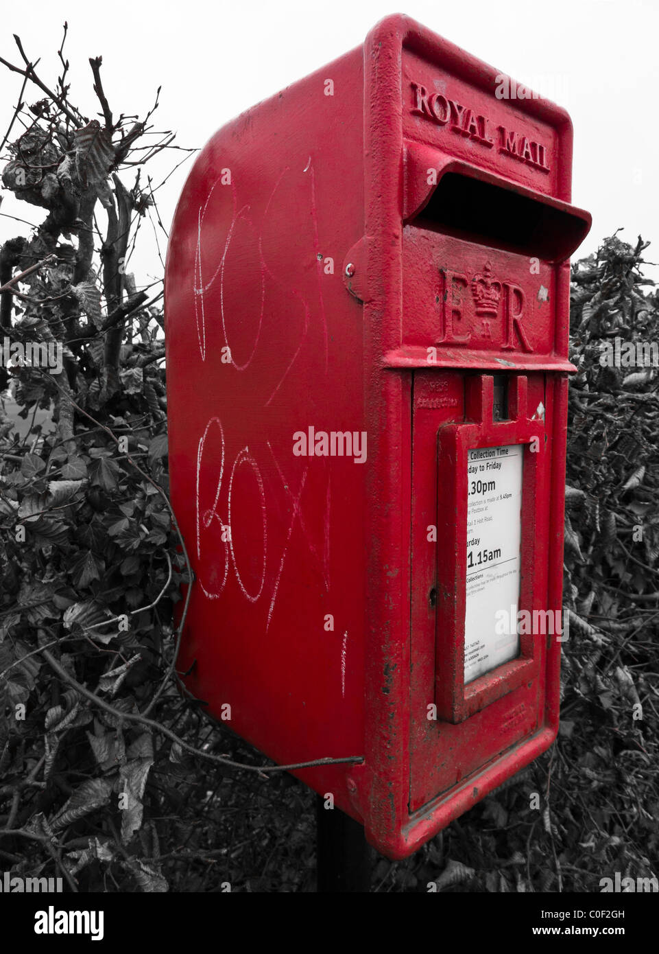 Royal Mail post box with "POST BOX" chalked on the side. Red on a ...