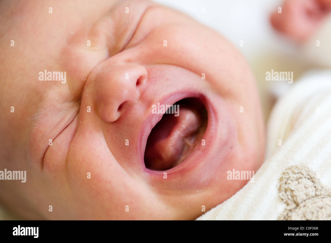 crying newborn baby Stock Photo - Alamy