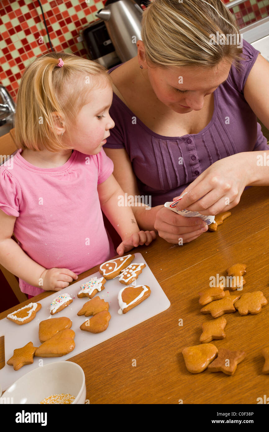 girl with her mother bakes gingerbread Stock Photo - Alamy