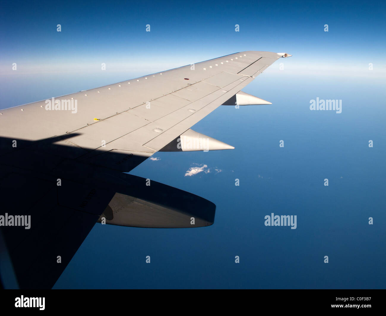 Wing of jet plane over Atlantic ocean Stock Photo - Alamy