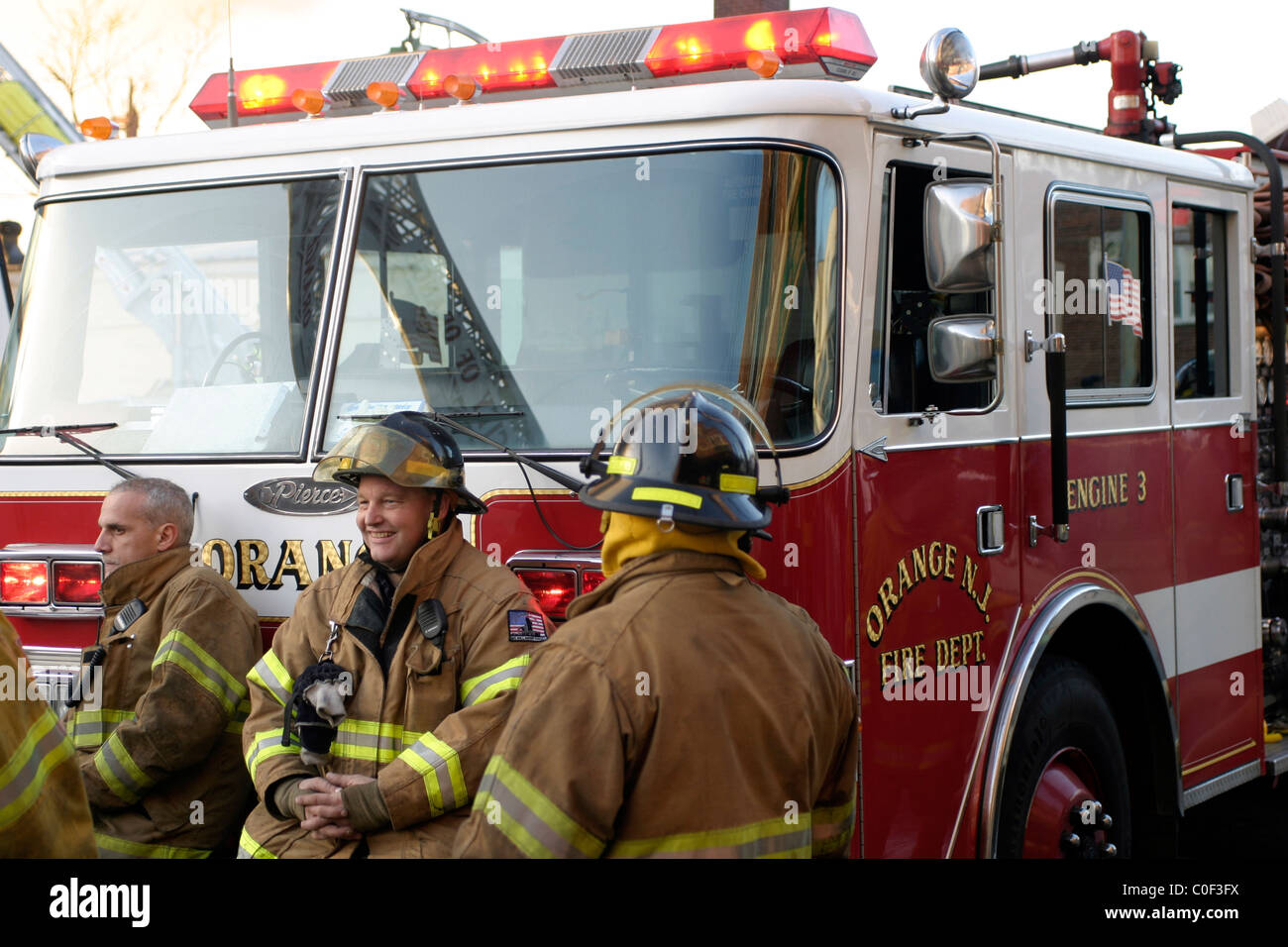 Firefighters take a break at the scene of a fire in New Jersey Stock ...