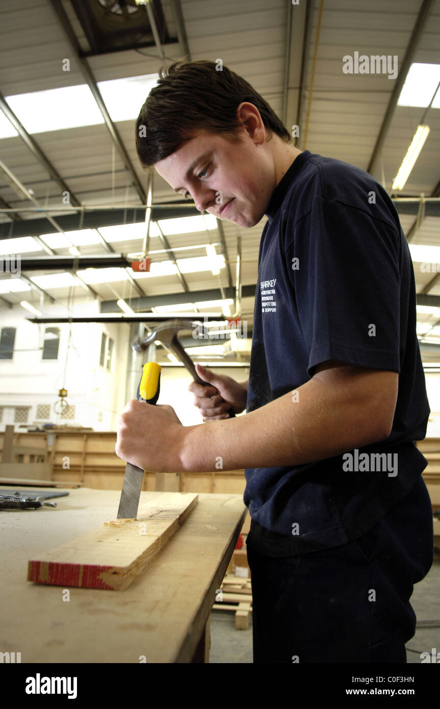 apprentice joiner with hammer and chisel Stock Photo - Alamy