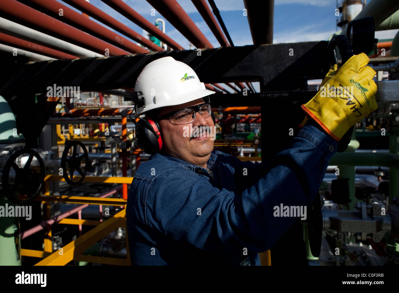 Men work at an oil refinery in Barrancabermeja, Colombia Stock Photo ...