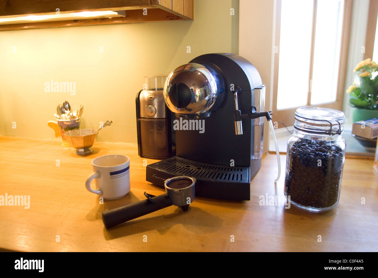 An expresso coffee maker on a kitchen counter Stock Photo - Alamy
