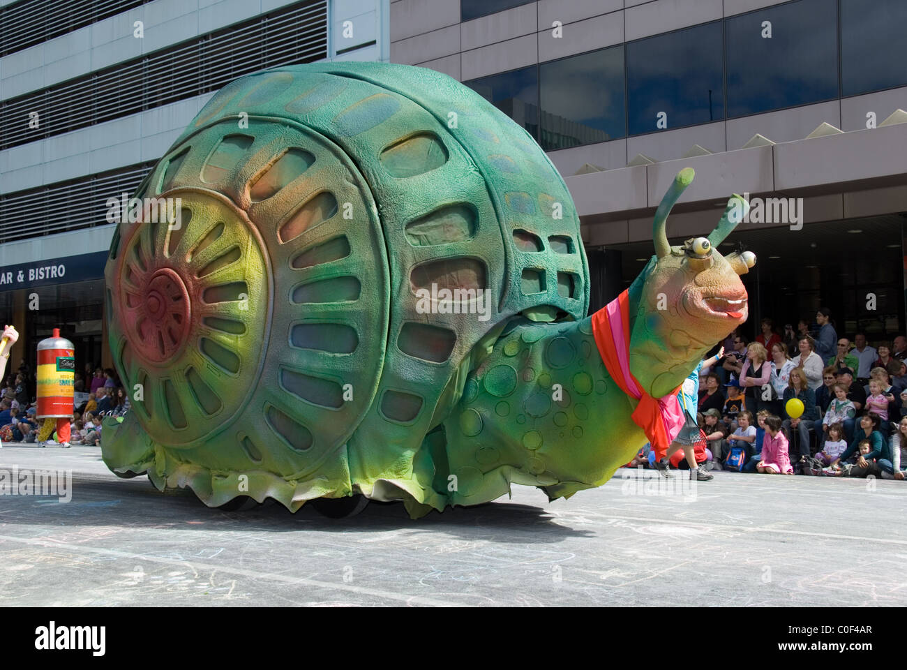 Large snail float in the Credit Union Christmas Pageant through the ...