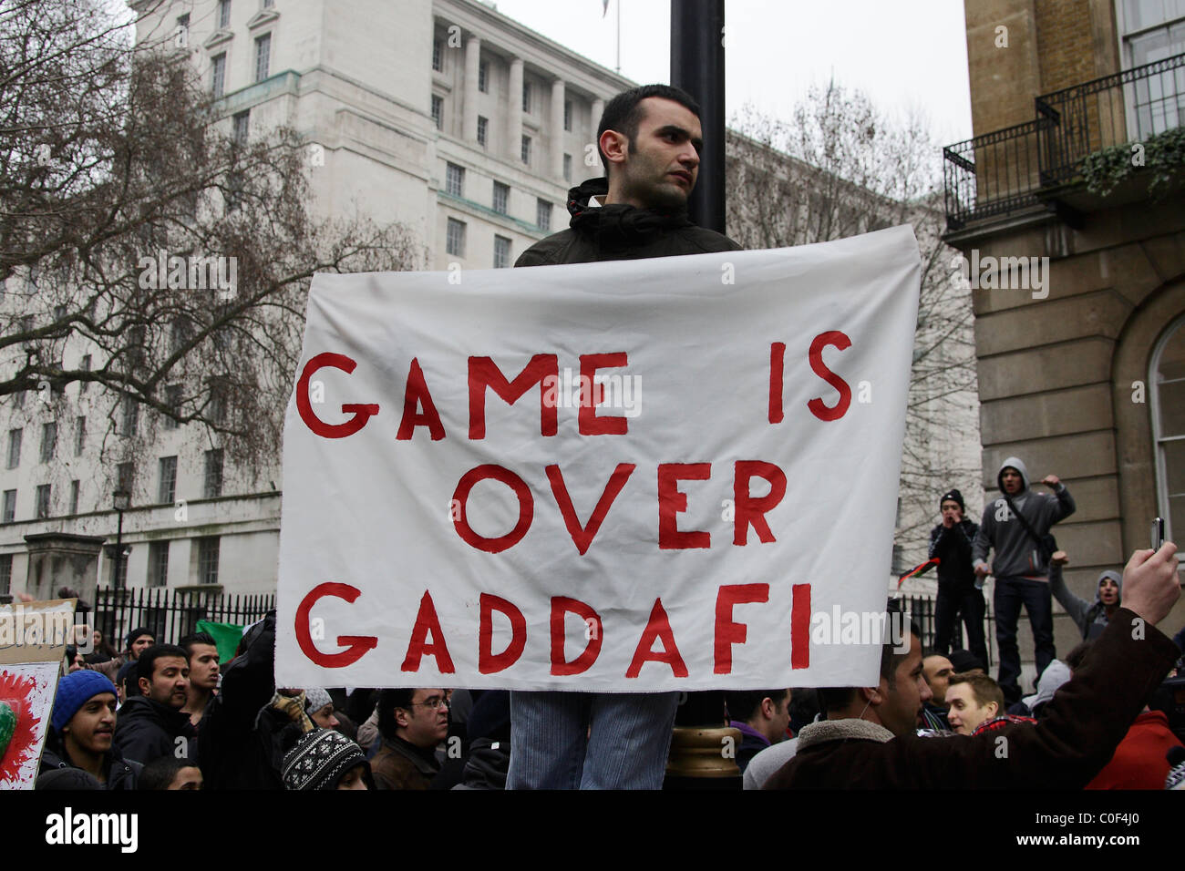 Game over banner at Libyan protest in London Stock Photo - Alamy