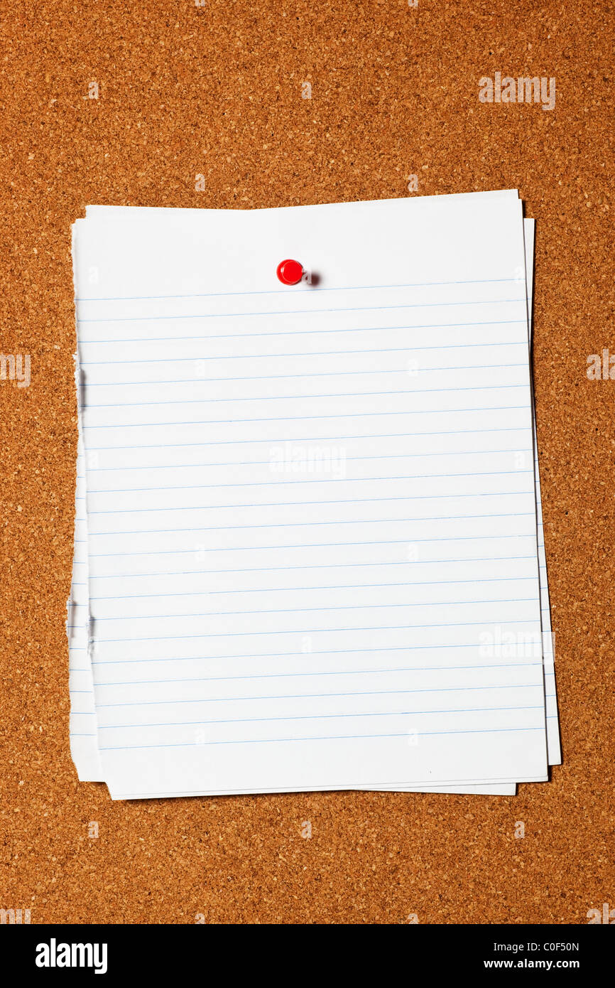 Pieces of writing paper pinned on corkboard Stock Photo - Alamy