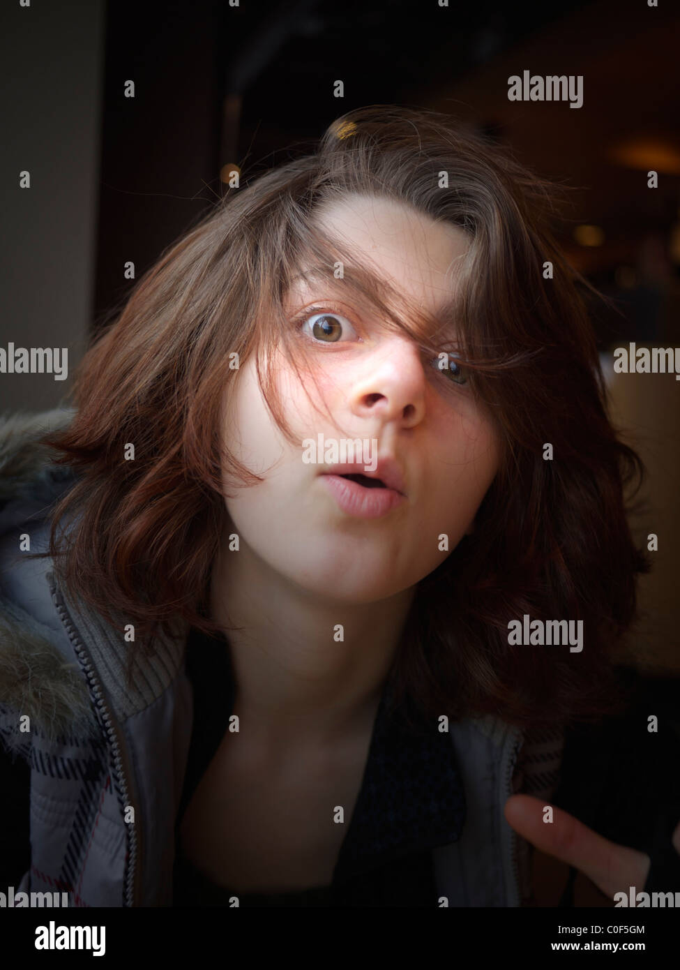 dramatic portrait of young girl looking afraid choked surprised Stock ...