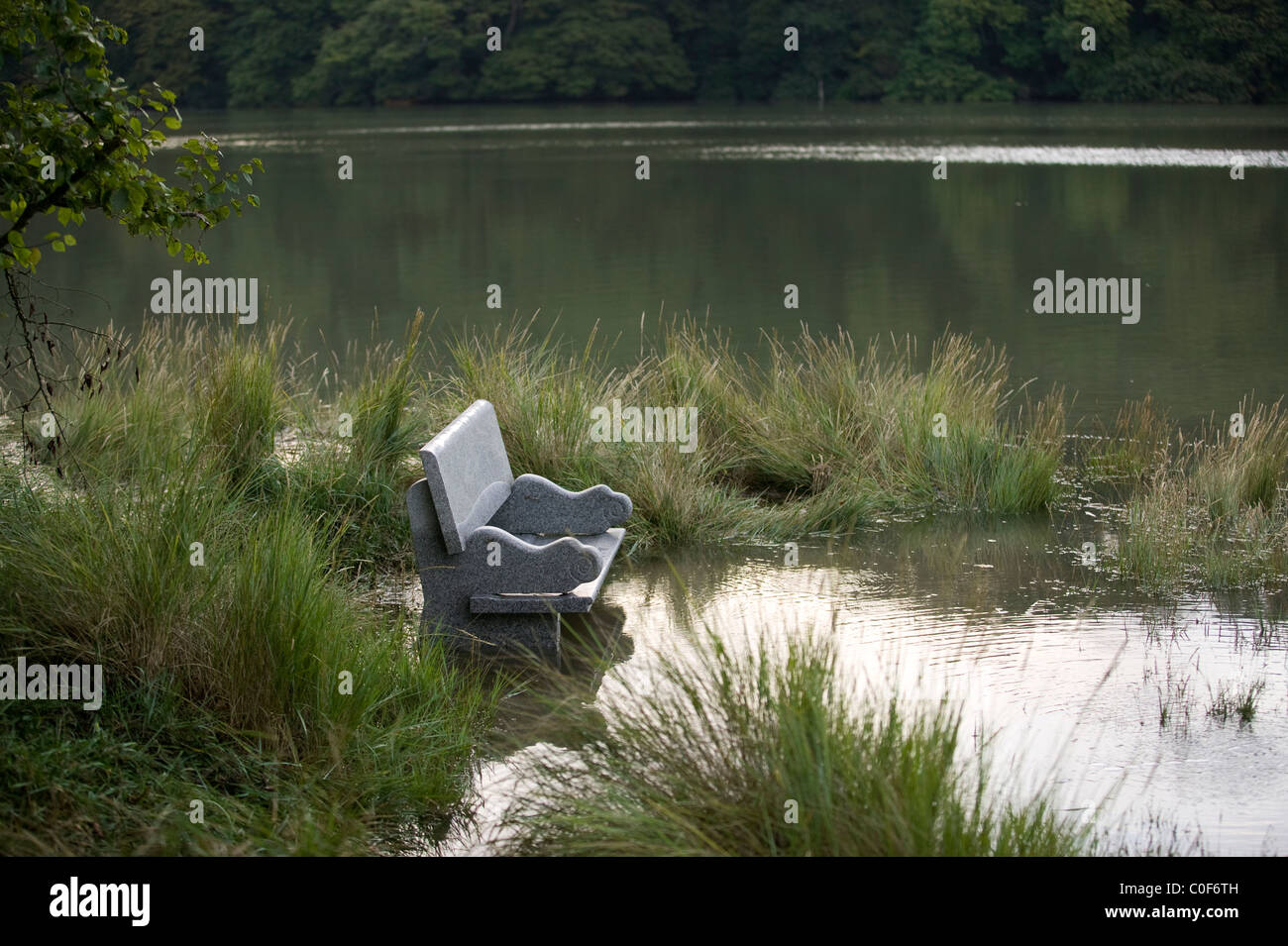 A stone bench isolated by the tide next to the Tresillian river near ...