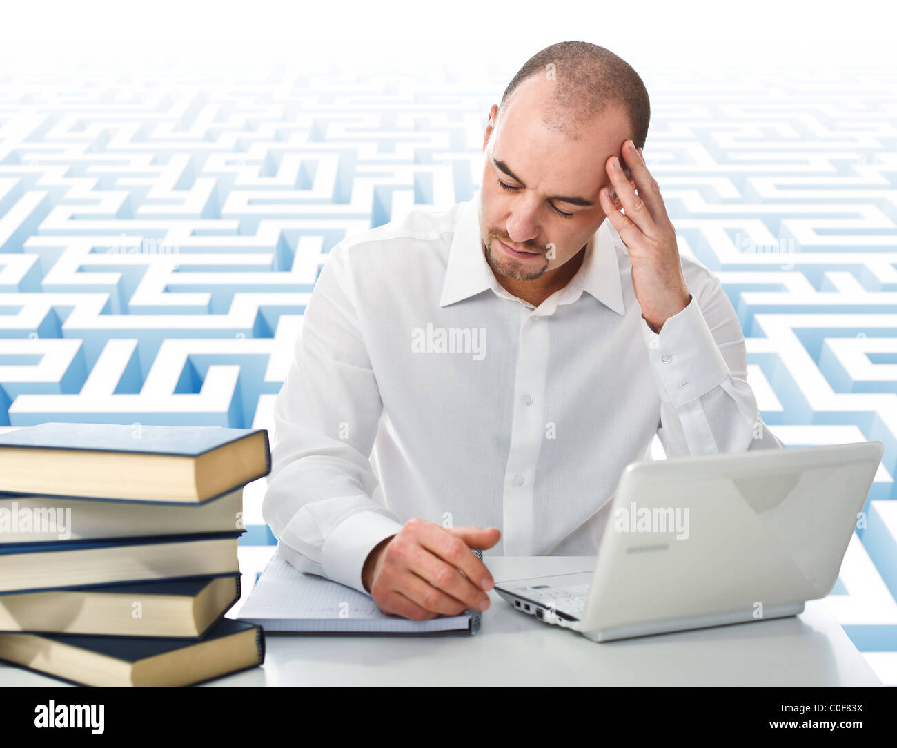 caucasian young man study at computer with 3d maze abstract background ...