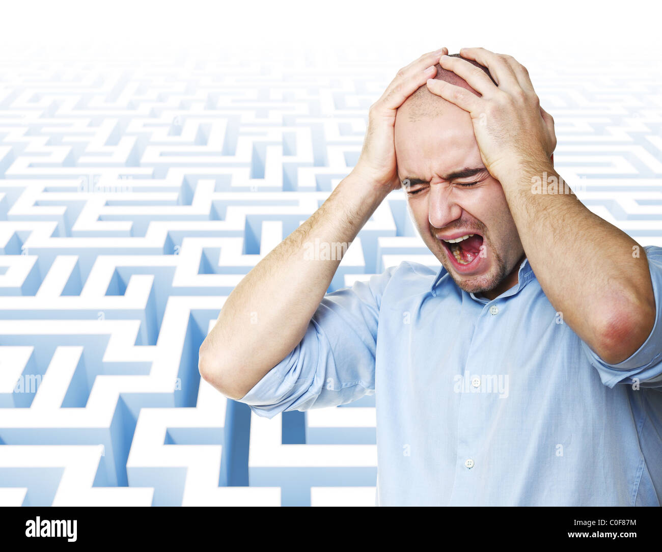 young caucasian man under stress and 3d maze background Stock Photo - Alamy