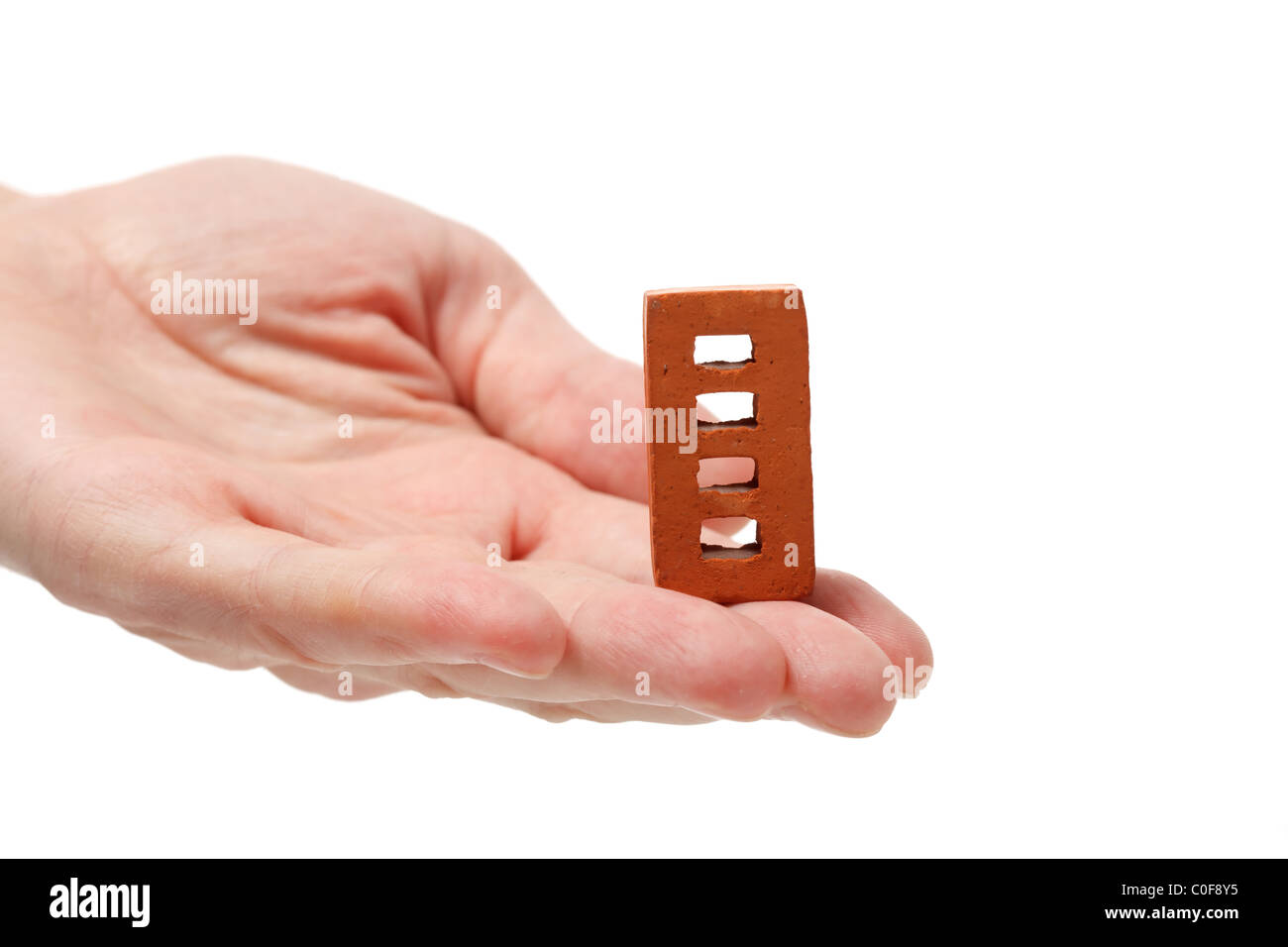 brick in the hand Stock Photo - Alamy