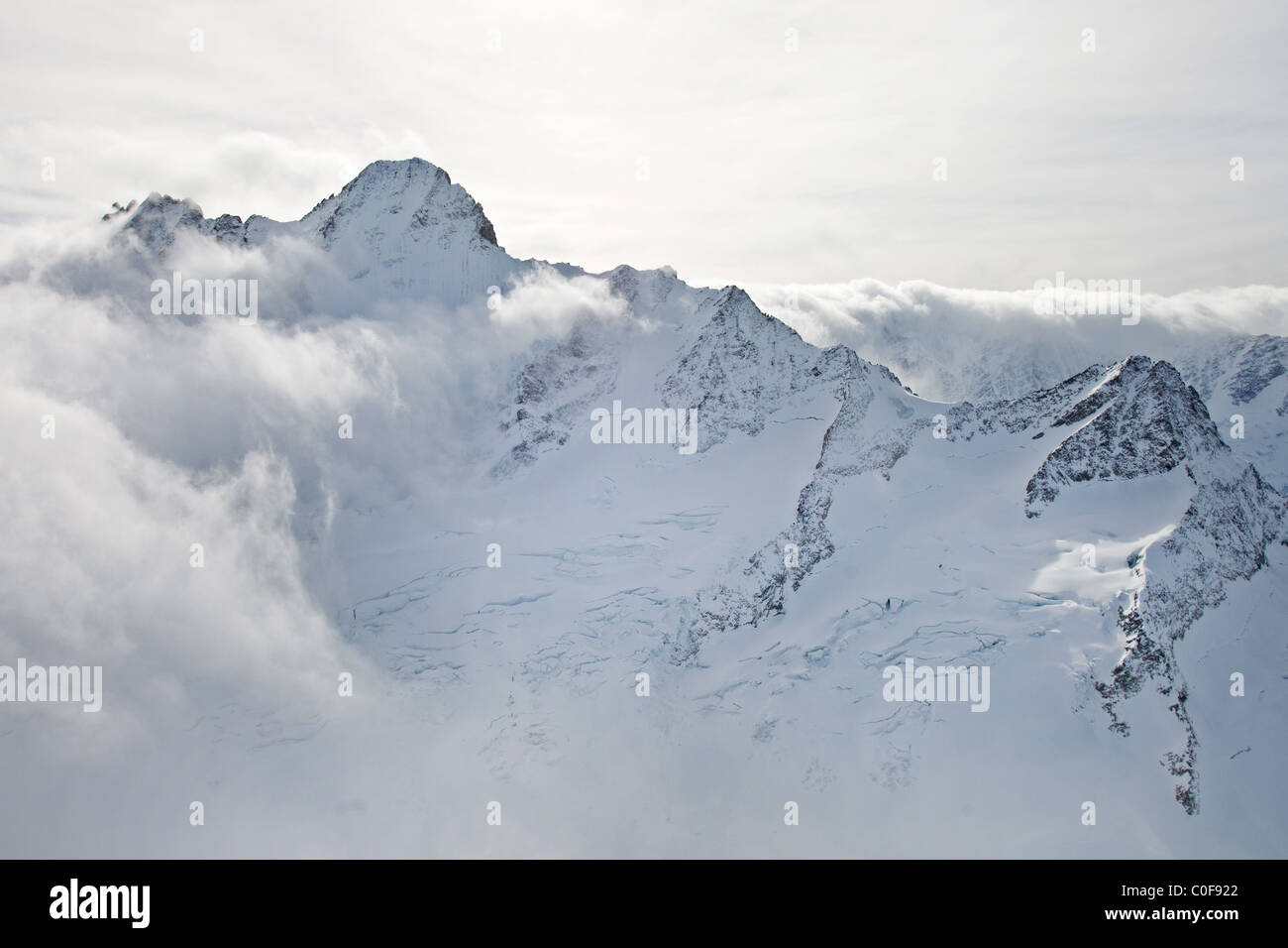 Mountain peaks surrounding the Eiger- Monch-Jungfrau seen from a ...