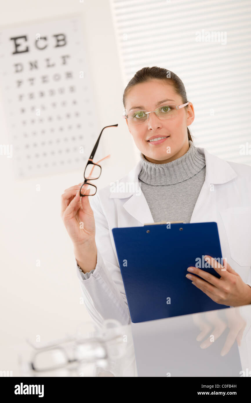 Optician doctor woman with prescription glasses and eye chart Stock ...