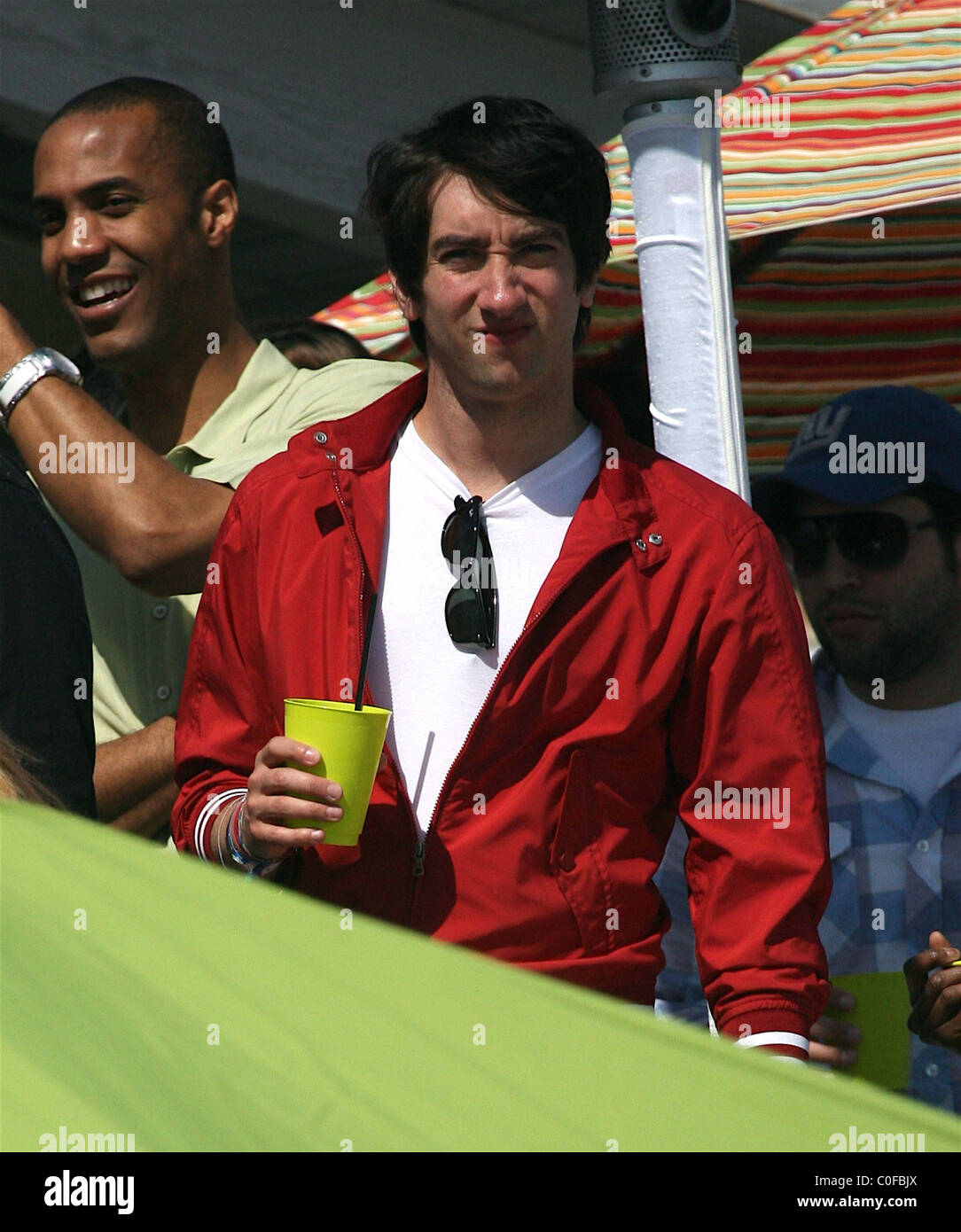 Tom Higgenson from the band Plain white T's having fun at a beach party ...