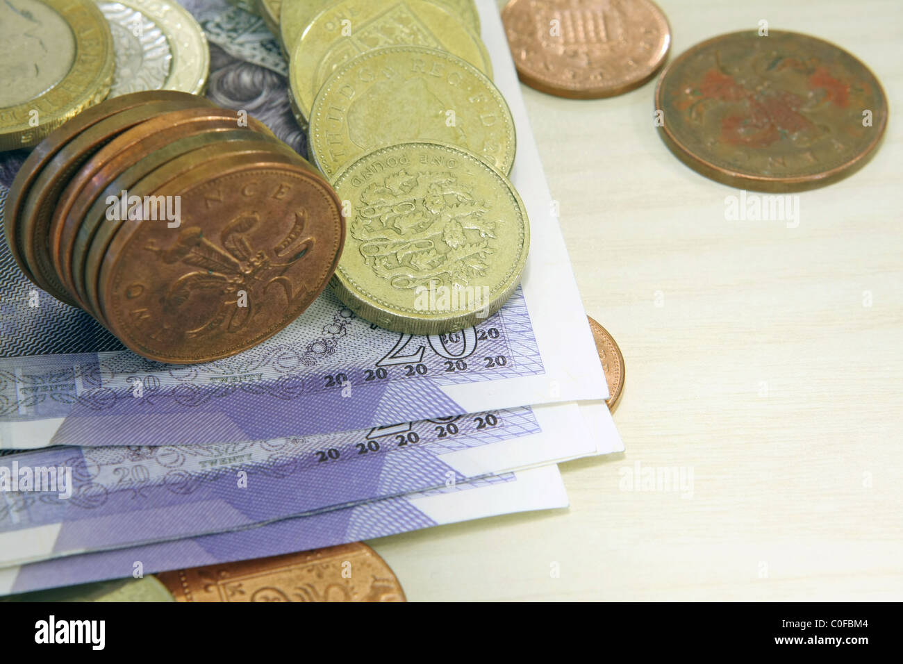 Some sterling £20 notes among some mixed denomination sterling coins ...