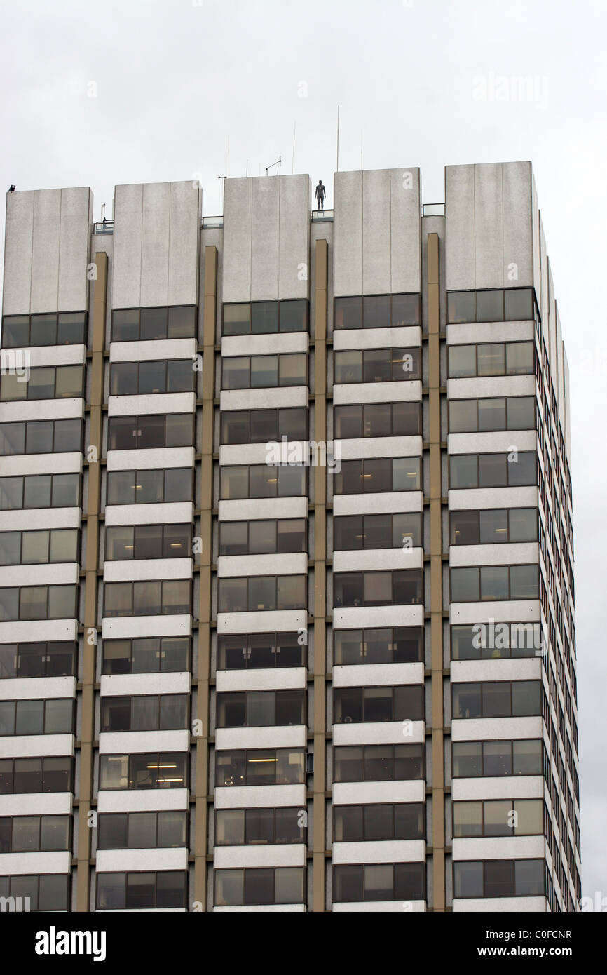 Antony Gormley sculpture on the rooftop of the ITV building. Part of ...