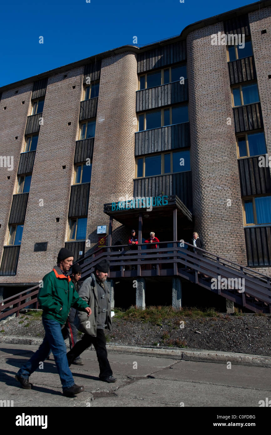 Miners walk past the Barentsburg hotel, a Russian coal mining town in ...