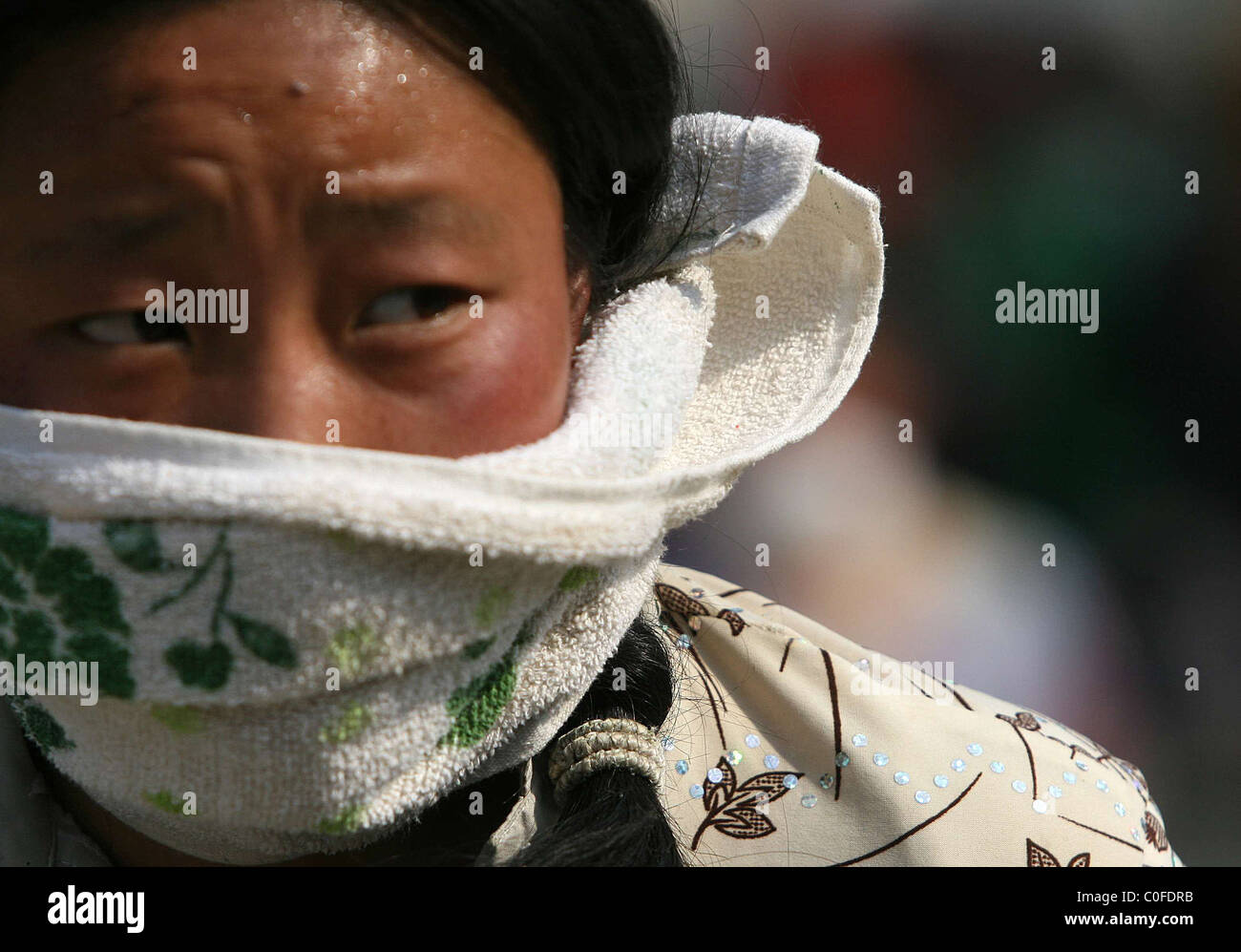 A woman leaves the area following the devastating earthquake which has ...