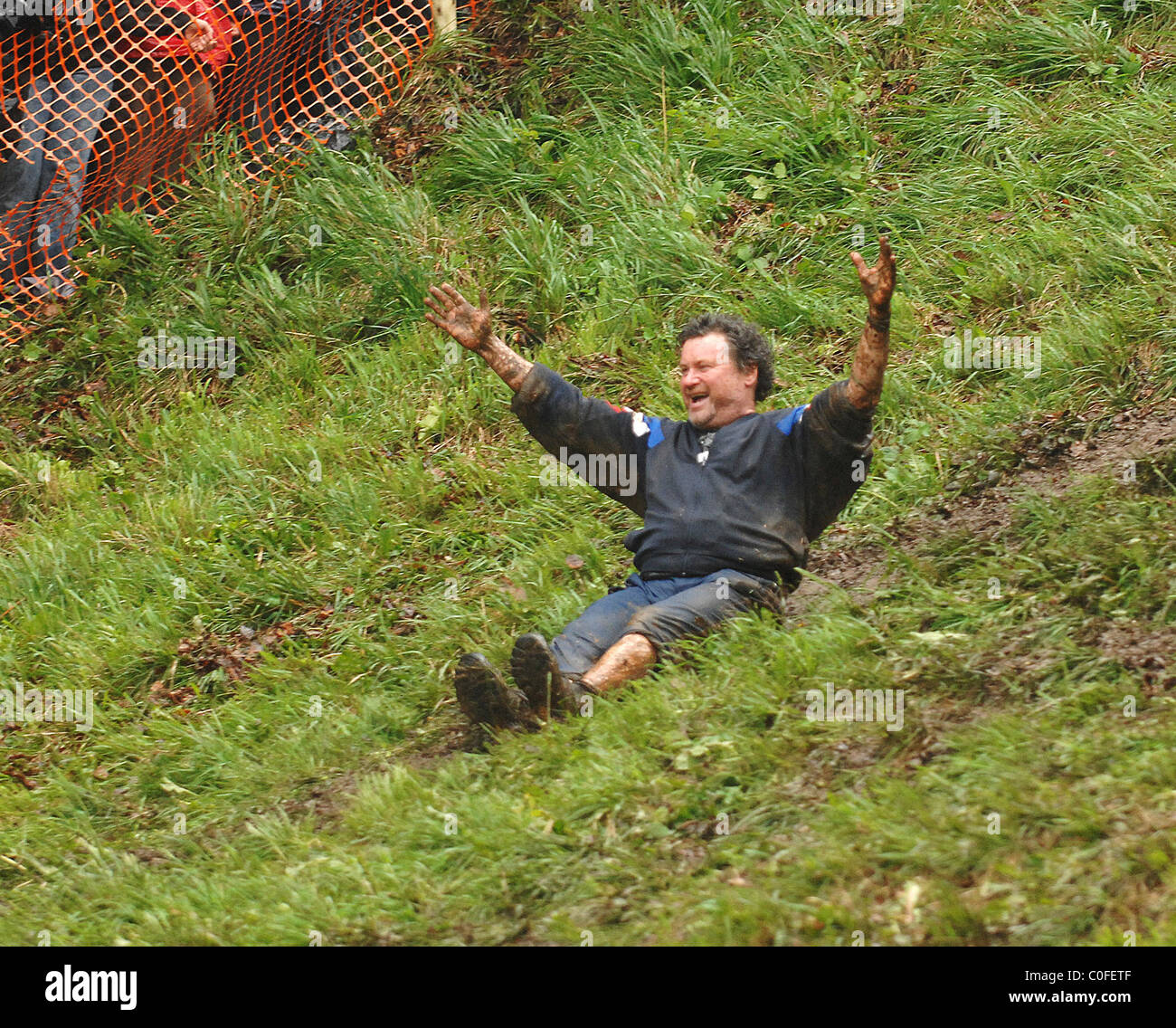Rory McGrath Competitors chase a Double Gloucester Cheese down the ...