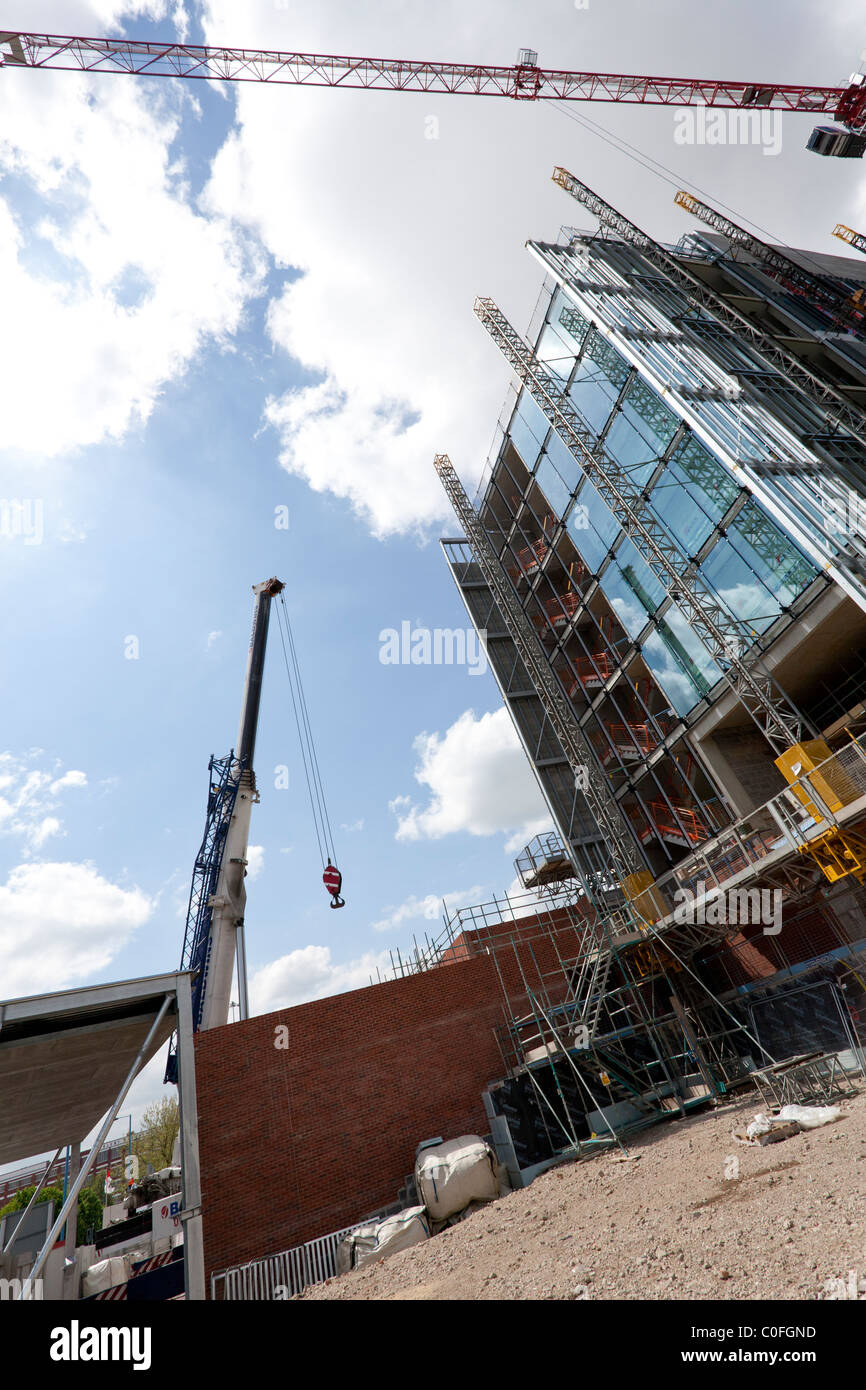 Crane lifting on construction site in UK Stock Photo - Alamy