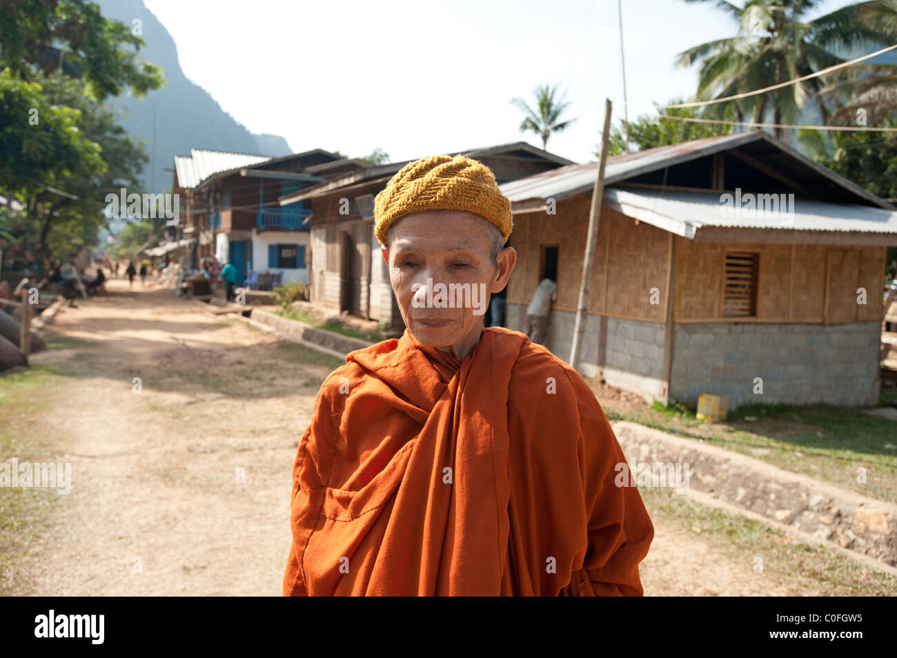 A blind elderly Buddhist monk in the village of Muang Ngoi Northern ...