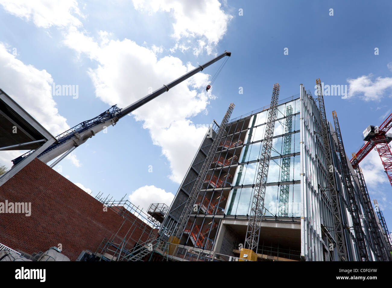 Crane lifting on construction site in UK Stock Photo - Alamy