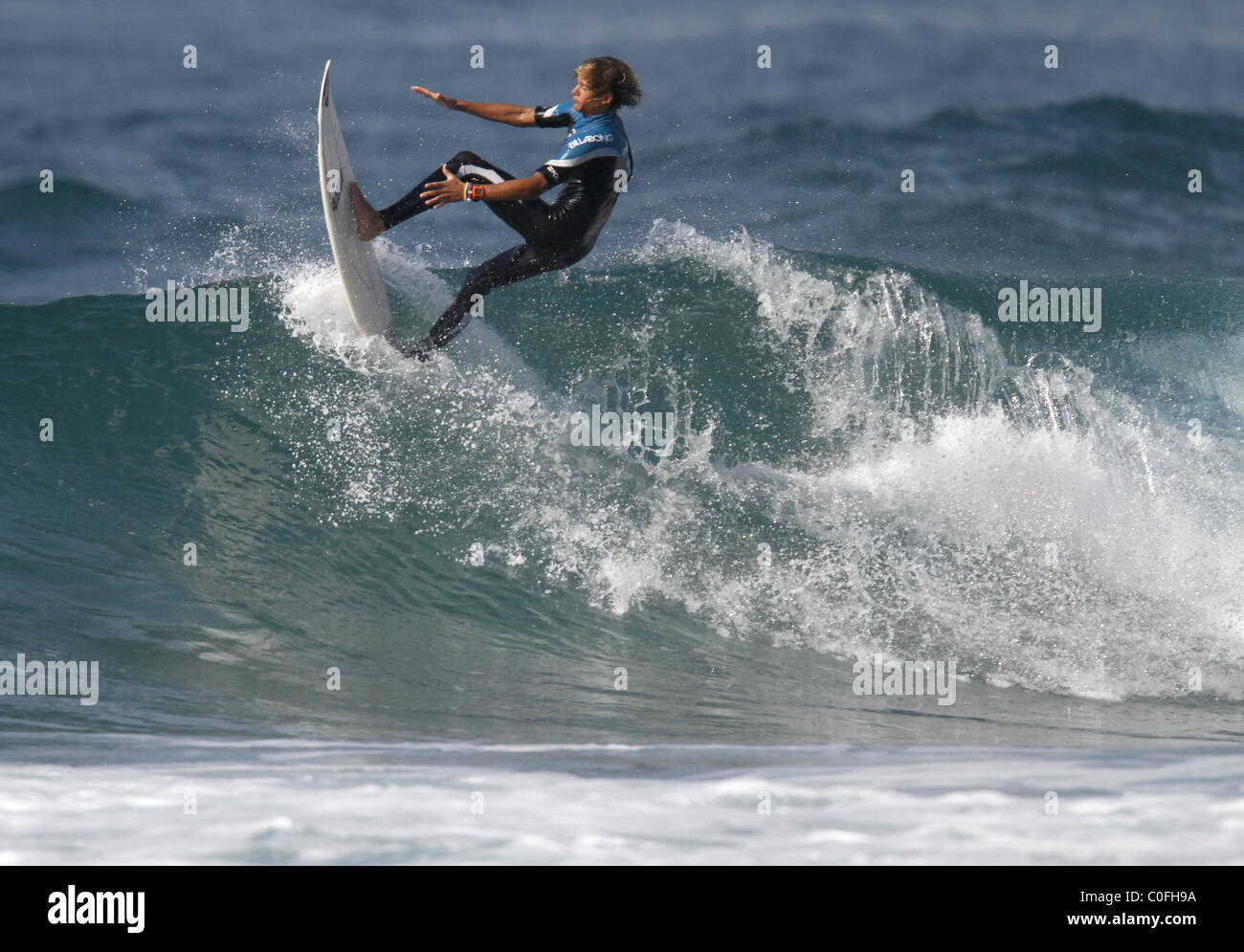 SURFER PRACTICING TRICK PRO SURFER PRO SURFER BALLITO DOLPHIN COAST ...