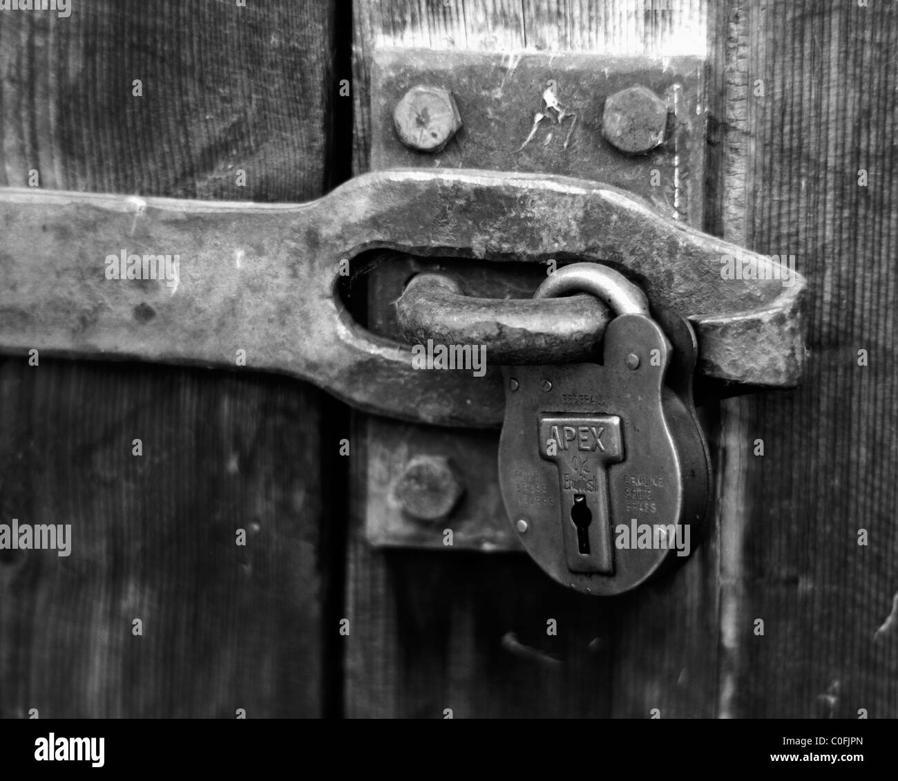 Large historic bronze barn door padlock Stock Photo - Alamy