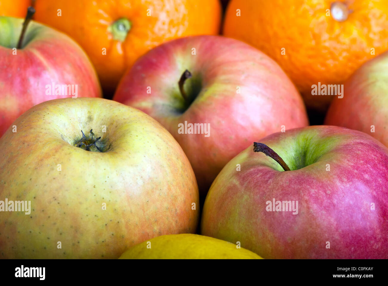 many apples and oranges close-up macro background Stock Photo - Alamy