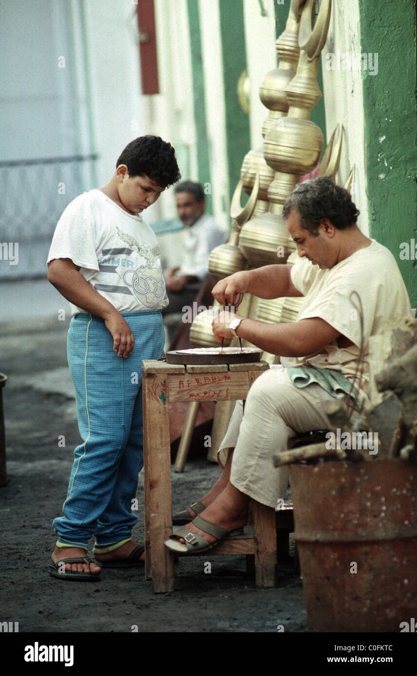 tripoli, libya -- a copper and brasssmith in the suk (bazaar) in the ...
