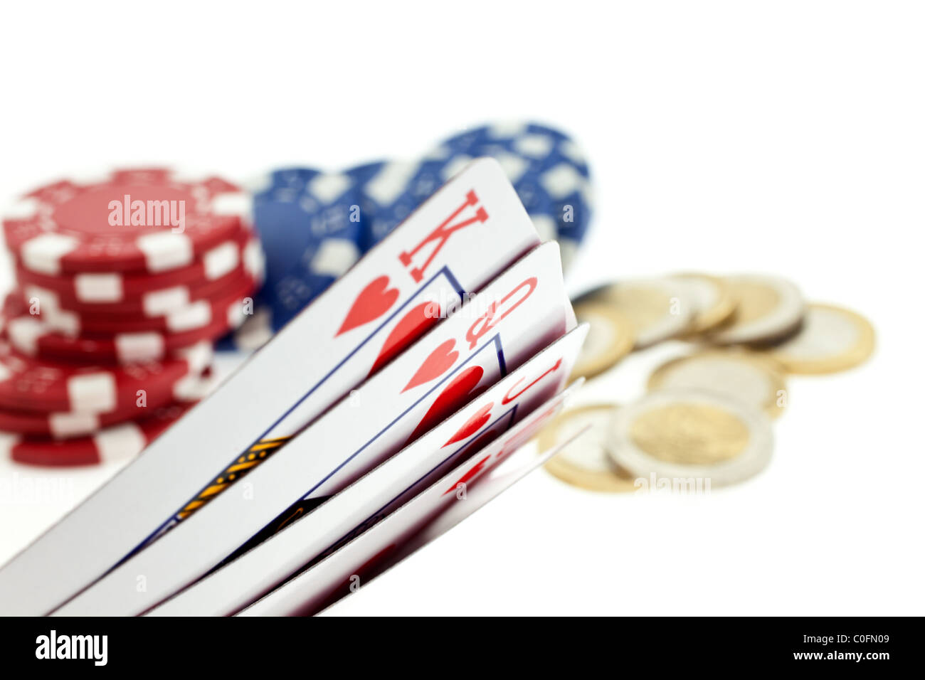 multicolor poker chips, playing cards and coins isolated on white ...