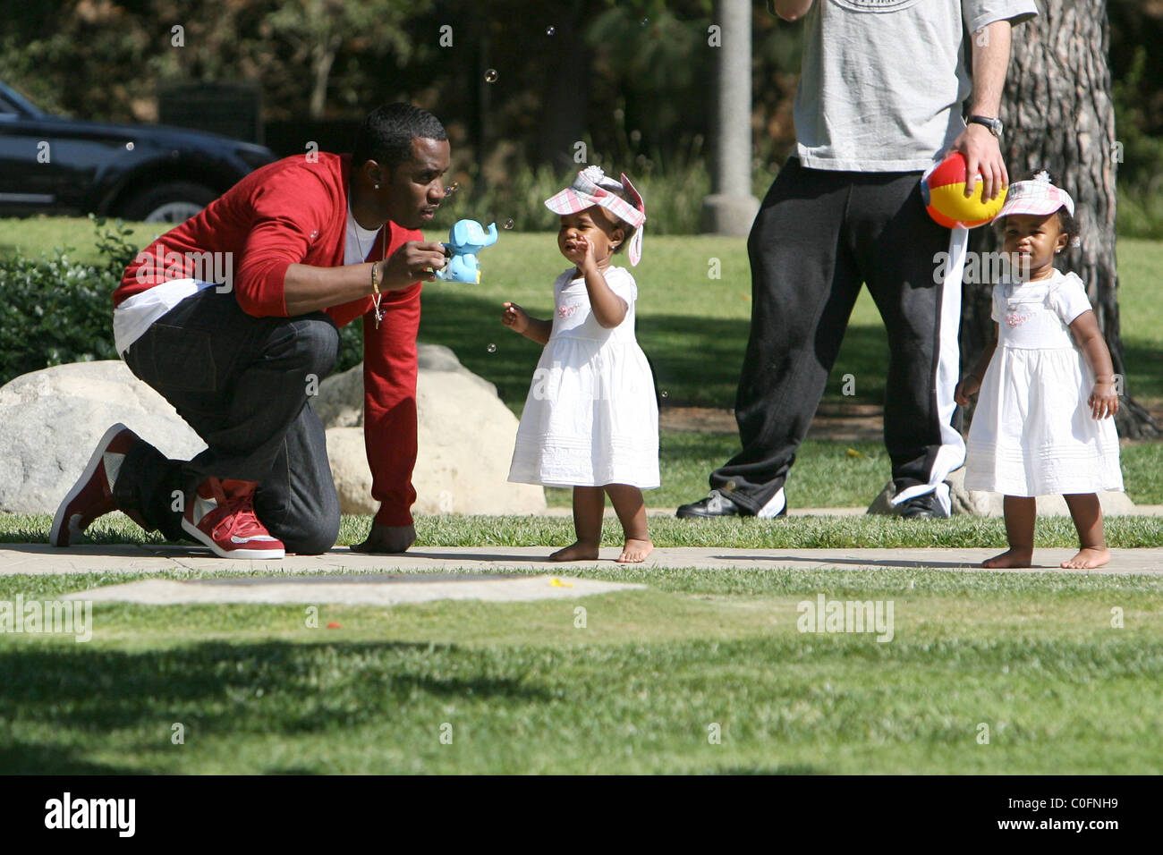 Sean 'P. Diddy' Combs plays with his twin daughters D'Lila Star Combs ...