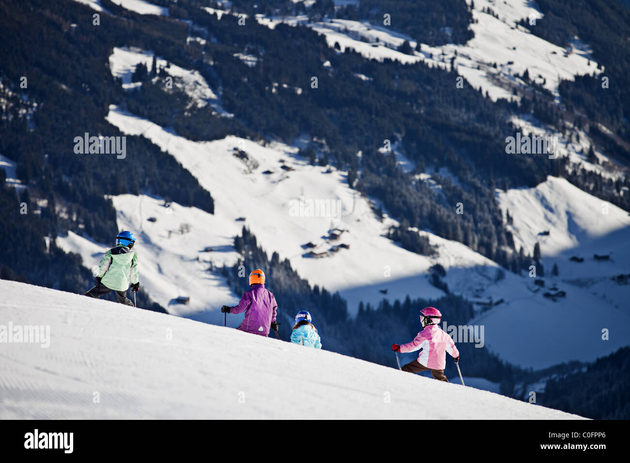 Children skiing from a steep slope, Zillertal valley, Austria Stock ...