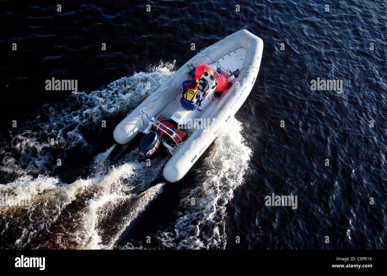 Aerial view of man driving Brig rigid inflatable boat / skiff ( RHIB ...