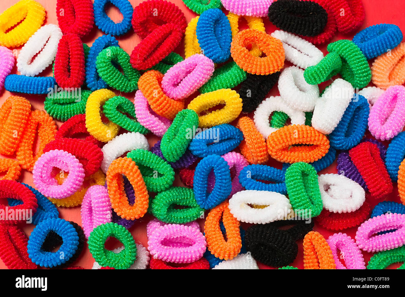 Background from colored hair binders. Close up Stock Photo - Alamy
