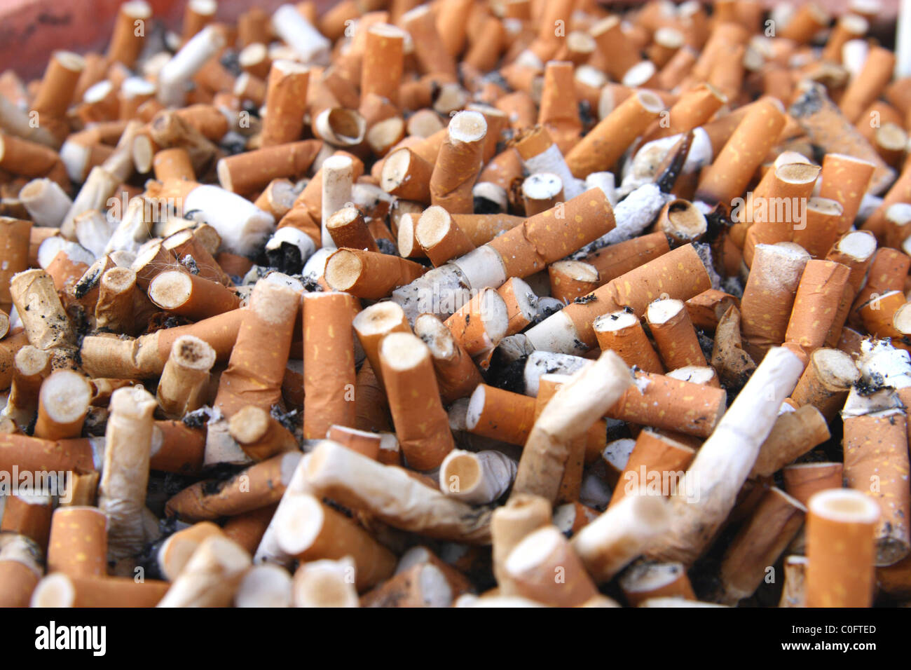 Plenty of cigarette butts. Close up view Stock Photo - Alamy