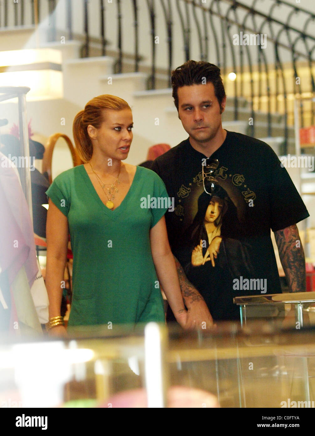 Carmen Electra and Korn guitarist Rob Patterson shoe shopping at ...
