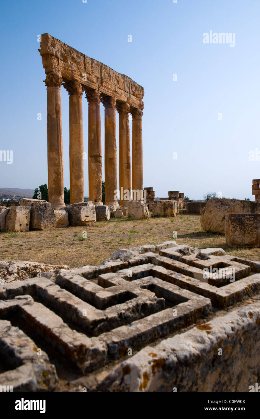 Swastika cross carved in a stone and the Temple of Jupiter, Baalbek ...