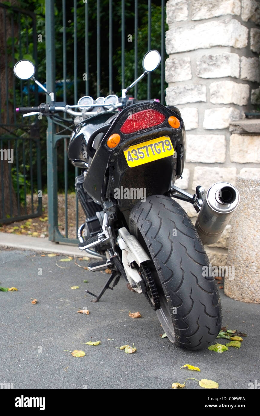 Rear view of a motorcycle parked on its stand Stock Photo - Alamy